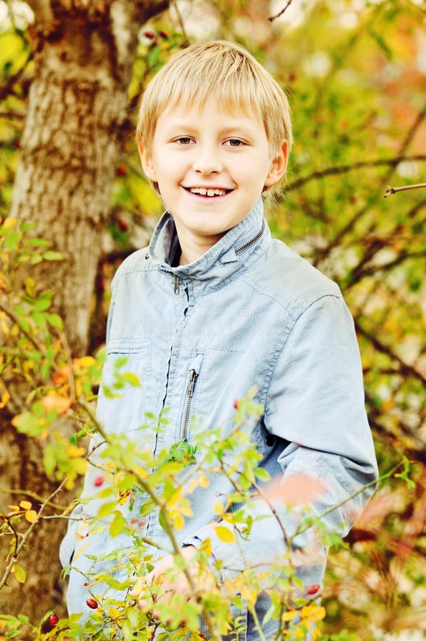 Boy in fall time stock image. Image of leaves, beauty - 32390301