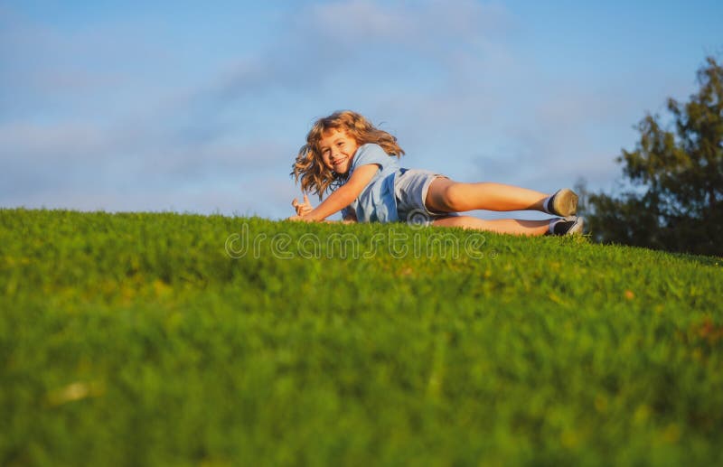 Boy Falling Down on Grass. Kid Falling Off at the Park. Stock Photo ...