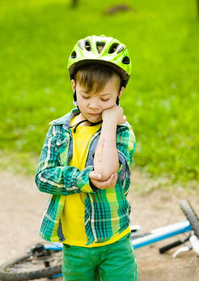 Boy Fell from the Bike in a Park Stock Photo - Image of pain, accident ...