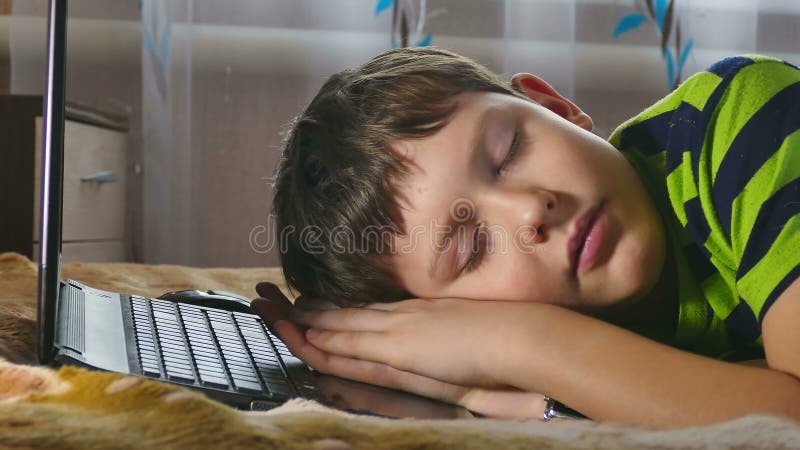 Little Boy Fell Asleep on the Laptop. Child Lay with Closed Eyes and ...