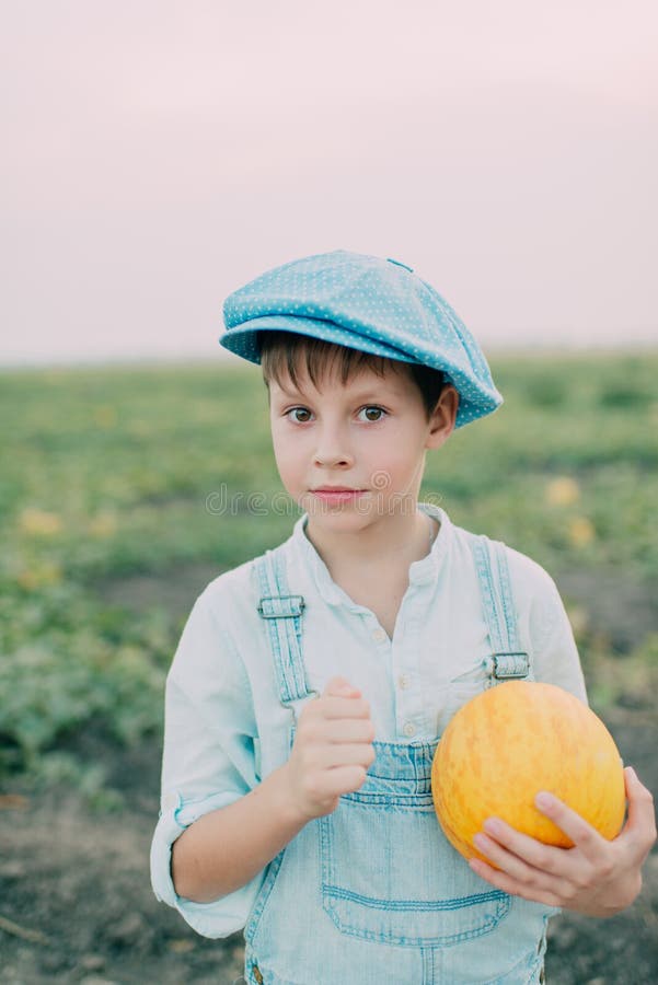 Mom and Son on a Field with Melons Stock Photo - Image of crop, fruit: 75263370