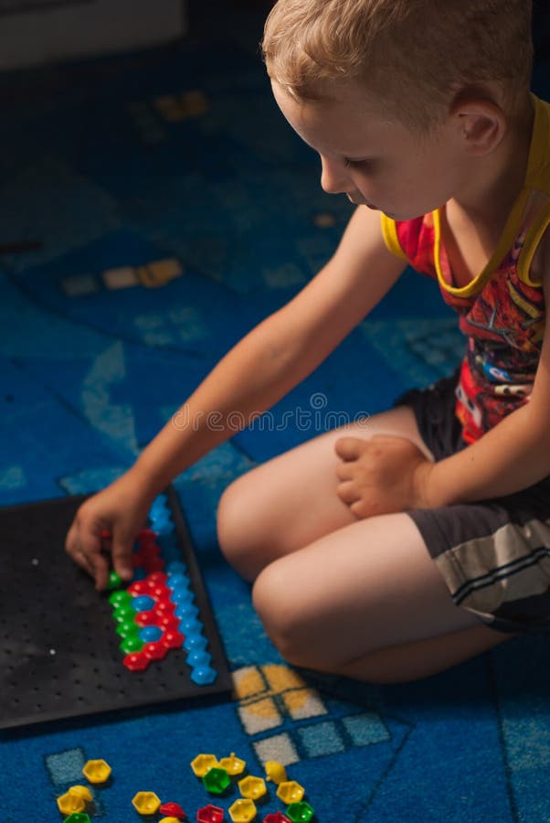 The boy is figures stock photo. Image of child, holding - 75082800