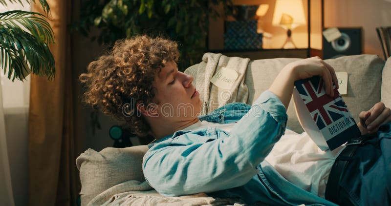 A Boy in Final Year of High School is Preparing for Exam, Studying ...