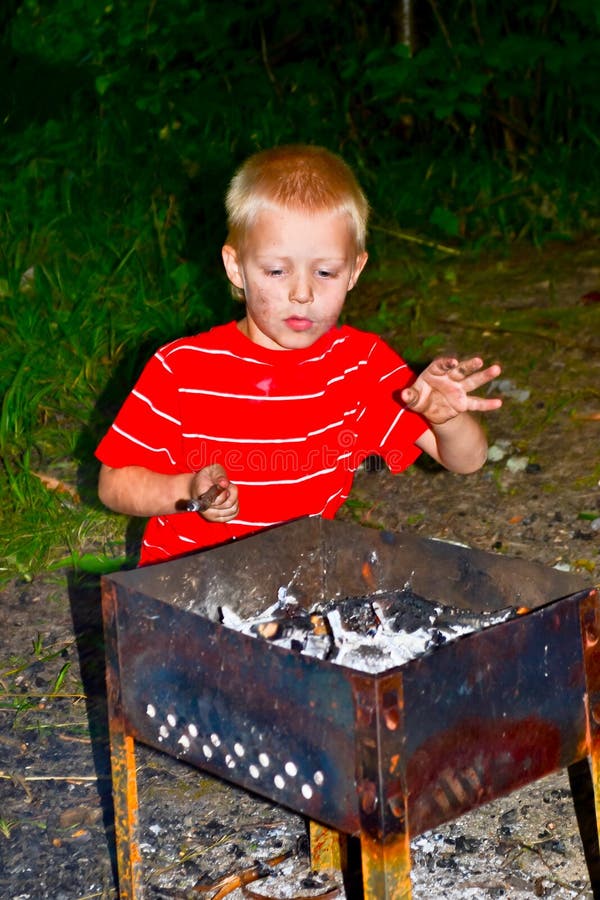 A boy and a fire stock image. Image of smile, happiness - 33031563