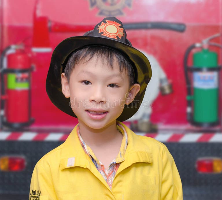 Boy in firefighter uniform stock photo. Image of childhood - 44486540