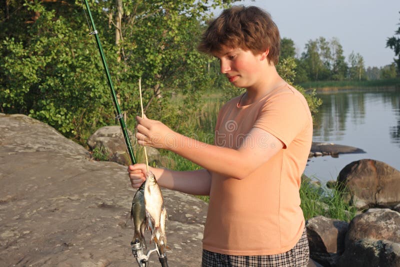 Boy with fish stock photo. Image of outdoors, holidays - 4901356