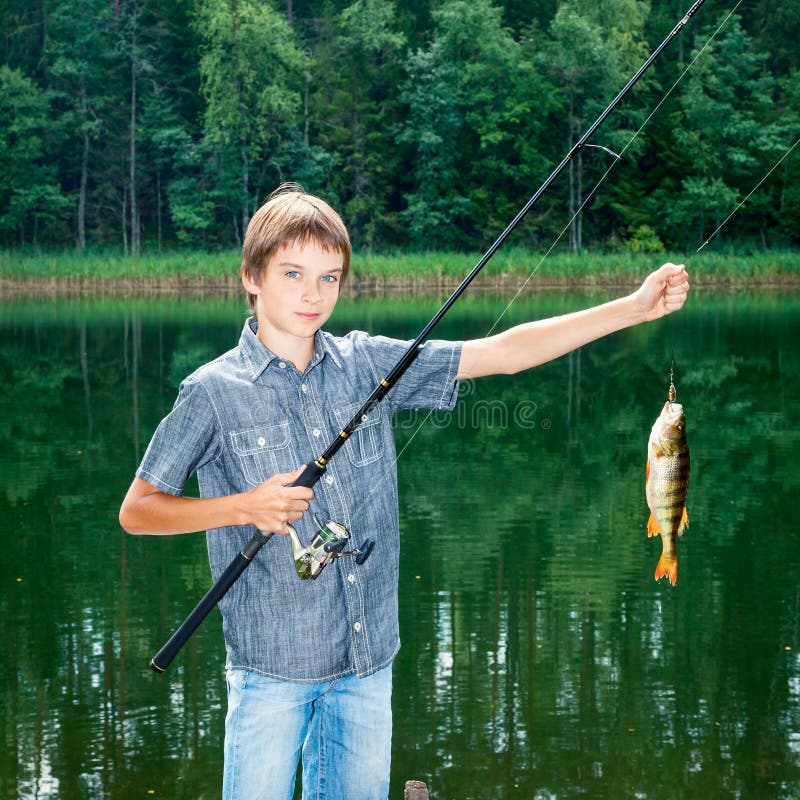 Boy with fish stock photo. Image of happy, fisherman - 43558730