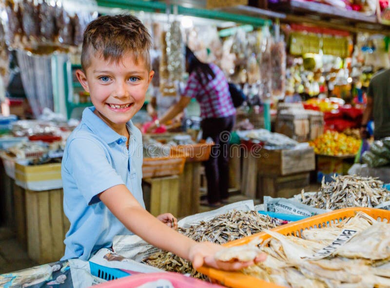 Boy at fish market stock image. Image of fauna, authentic - 69932803