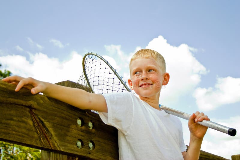 Boy with fishing net stock photo. Image of portrait, holding - 27395558