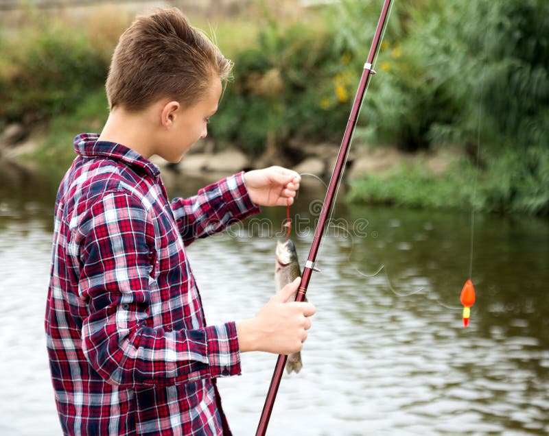 Boy Fishing Using Rod from Water Side Stock Photo - Image of child ...
