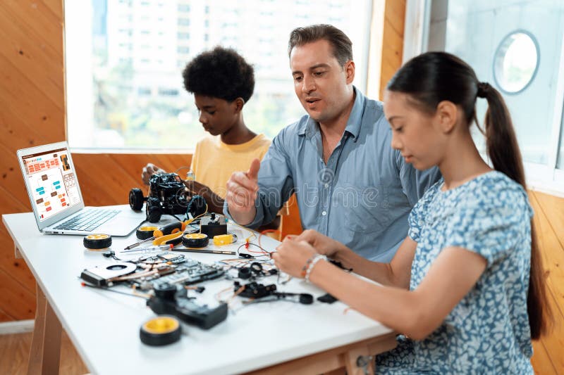 Boy Fix Motherboard of Robotics Car Use Screwdriver in STEM Class ...