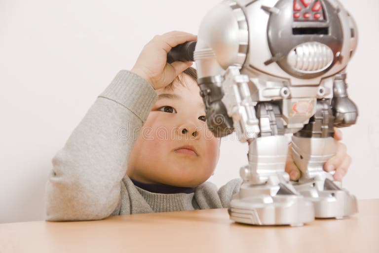 Boy fixing robot stock image. Image of children, toys - 13095737