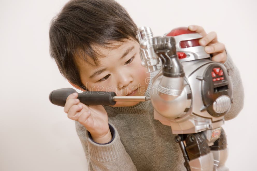 Boy fixing robot stock photo. Image of expressions, child - 13095818