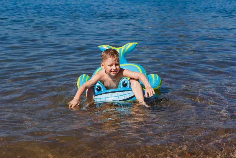 Baby Floats in an Inflatable Round in the Sea Stock Photo - Image of ...