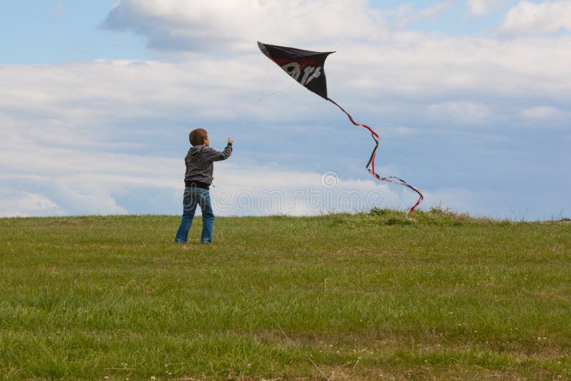 Boy flying Kite stock photo. Image of childhood, elementary - 26849376