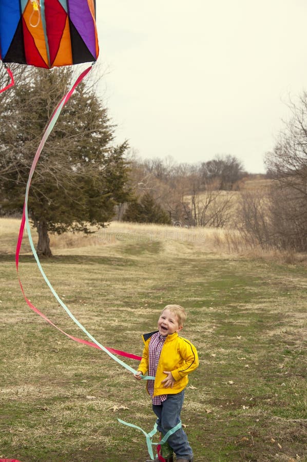 Boy flying kite stock image. Image of child, trees, outdoors - 39362169