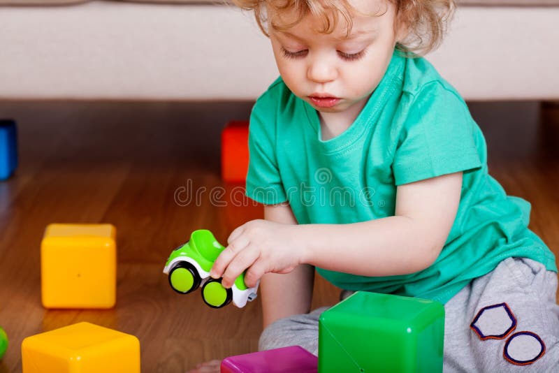 The boy focused on playing stock photo. Image of playing - 41379010