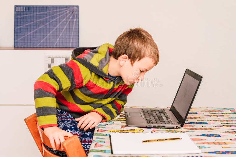 Boy Follows His School Classes through a Computer from Home with a ...