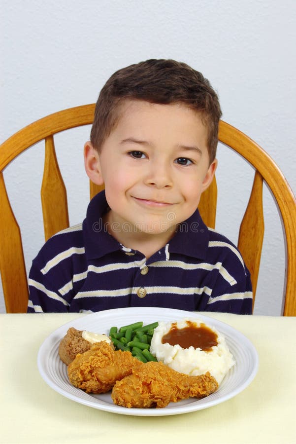 Boy And Fried Chicken Dinner Stock Photo - Image of enjoy, child: 5731178