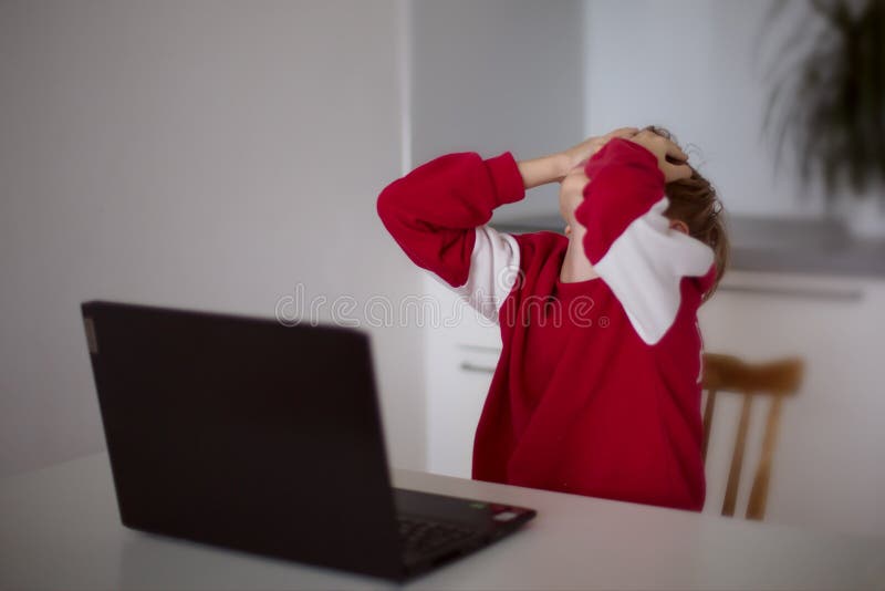 Boy in Front of Computer Looking Upset Stock Image - Image of ...
