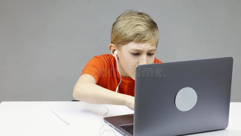 A Boy in Front of a Computer on Online Distance Learning Conducts a ...
