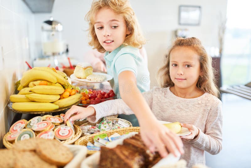 Boy and Girl at the Buffet in Cafeteria Stock Image - Image of ...
