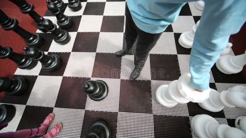 Boy and Girl Feet and Hands Playing Chess on Big Stock Footage - Video ...