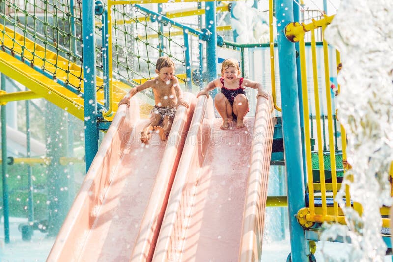 Boy and Girl Have Fun in the Water Park Stock Photo - Image of daughter ...