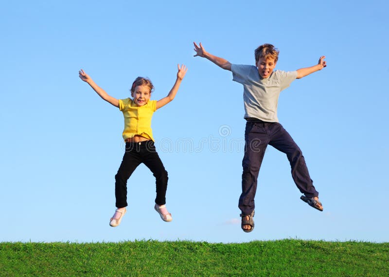 Boy and Girl Jump Together at Grass Stock Image - Image of children ...