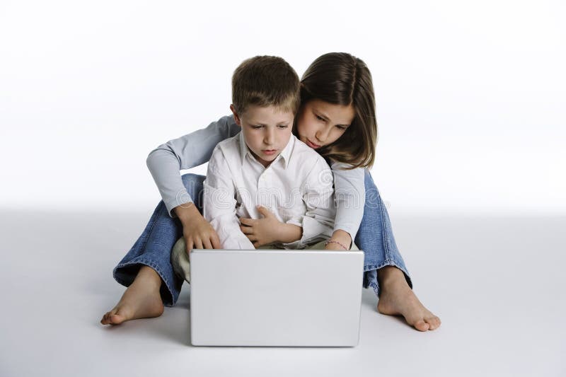 Boy And Girl With Laptop Computer Picture. Image: 9931107