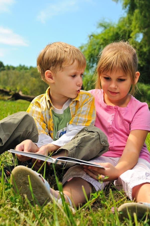 Boy and Girl are Reading a Book Stock Photo - Image of reader, happy ...