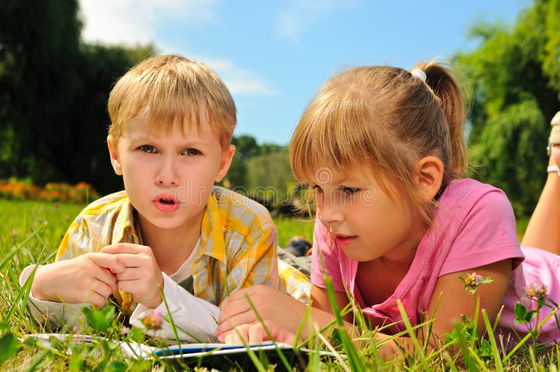 Boy and Girl are Reading a Book Stock Image - Image of small, family ...