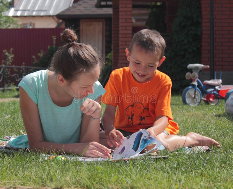 Boy and girl reading book stock photo. Image of girls - 42173674
