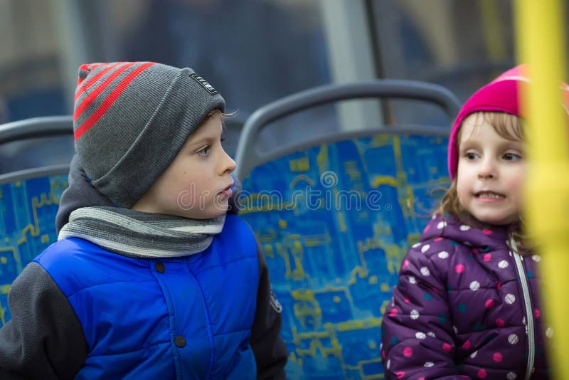 A Boy and a Girl Ride on a Bus. Close-up Stock Image - Image of close ...