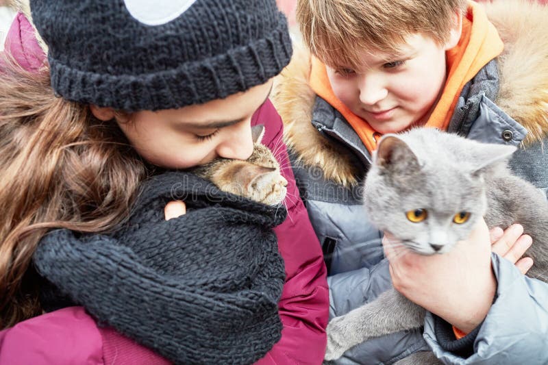 Boy and Girl Stand Holding Cats in Stock Image - Image of natural ...