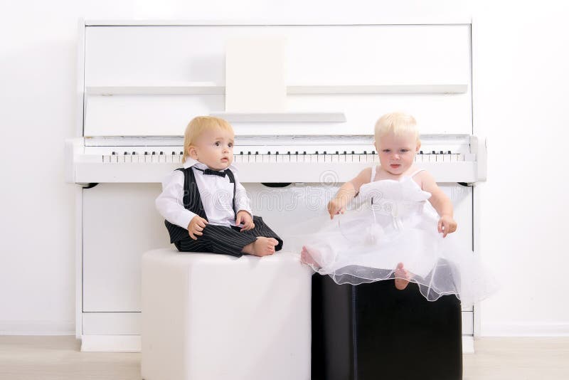Boy and Girl in a Suit Sitting on Box Stock Photo - Image of lifestyle ...