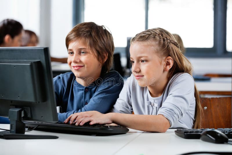 Boy and Girl Using Desktop Pc in School Computer Stock Image - Image of ...