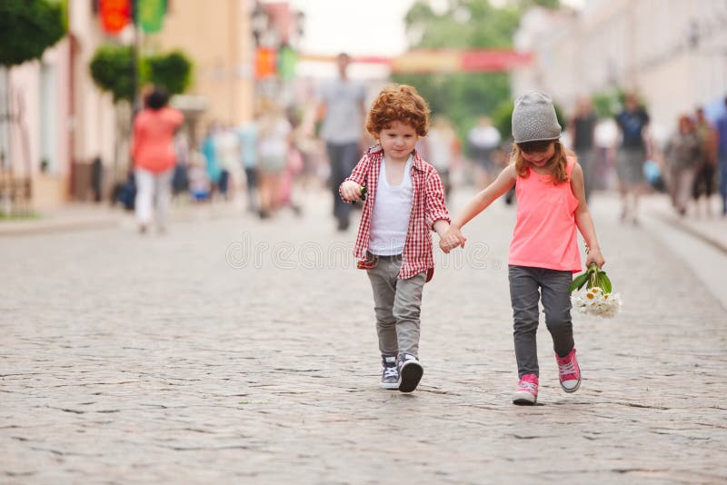 Boy and Girl Walking on the Street Stock Image - Image of bouquet, cool ...