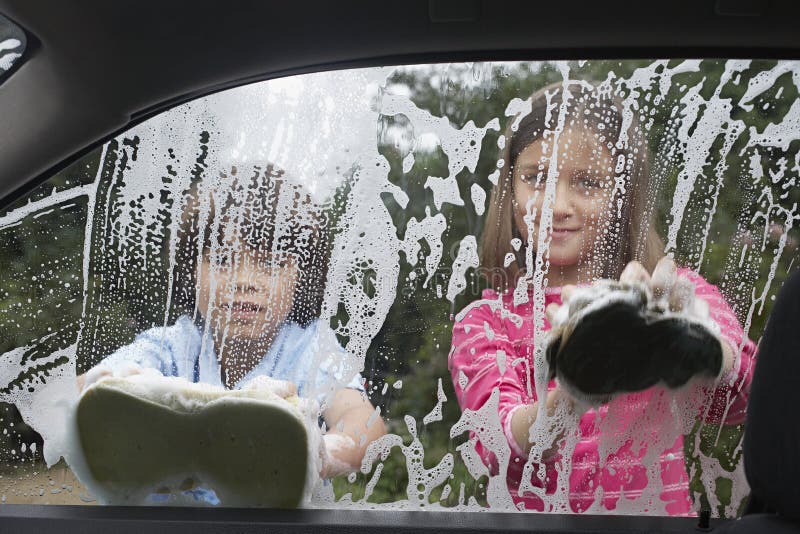 Boy and Girl Washing Car Together View from Inside Car Stock Photo ...