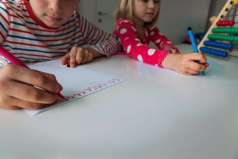 Boy and Girl Writing Numbers, Kids Doing Homework Stock Photo - Image ...
