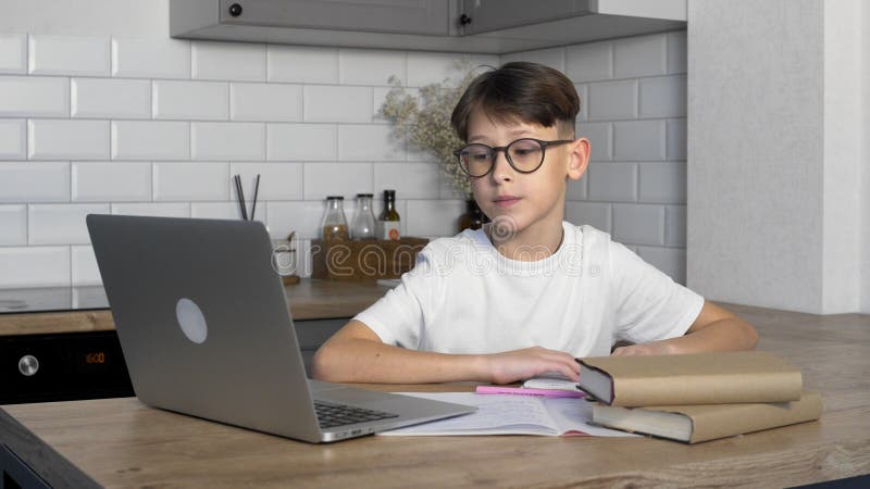 A Boy with Glasses is Doing His Homework. Study Stock Image - Image of ...