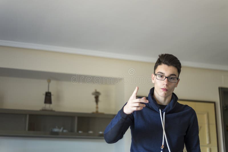 Boy with glasses pointing stock photo. Image of horizontal - 79005312