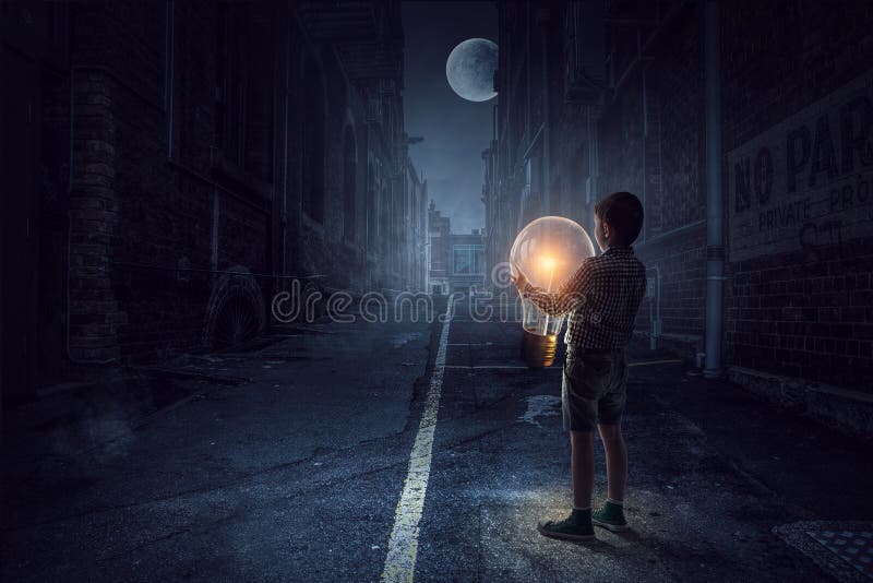 Boy with a Glowing Light Bulb Stock Photo - Image of electric, scary ...