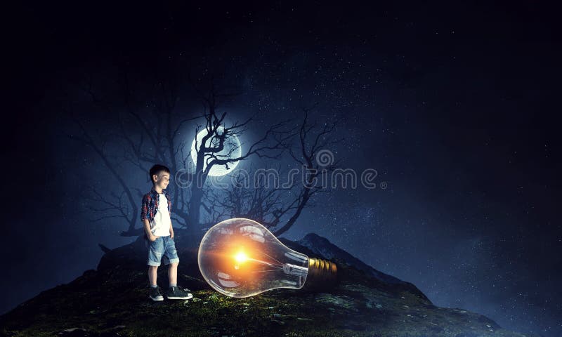 Boy with a Glowing Light Bulb Stock Photo - Image of power, little ...
