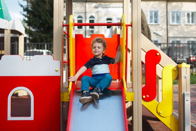 Boy Goes for a Drive on a Children S Hill Stock Image - Image of outdor ...