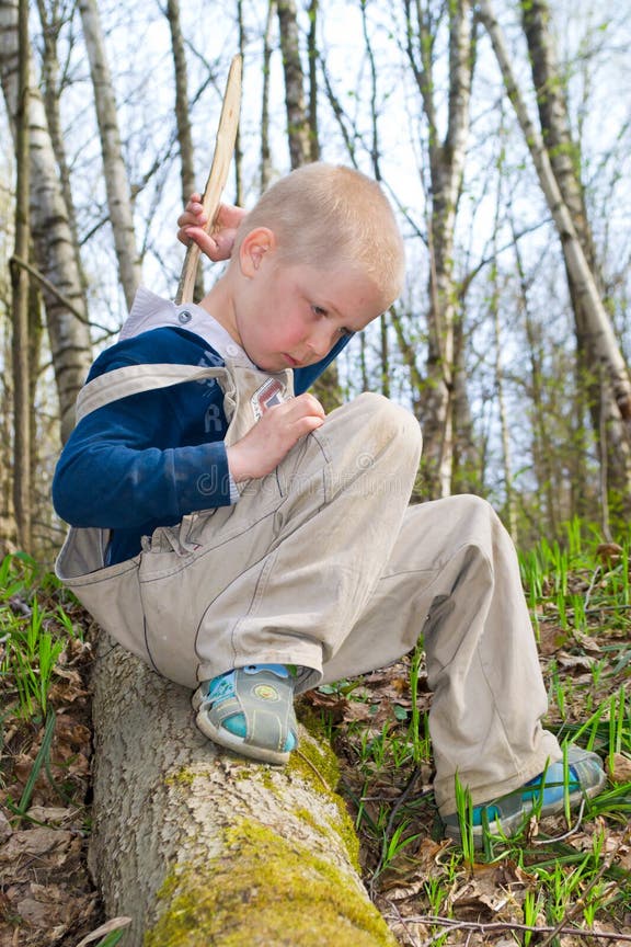 Boy goes on a log stock image. Image of blue, fallen - 40332249
