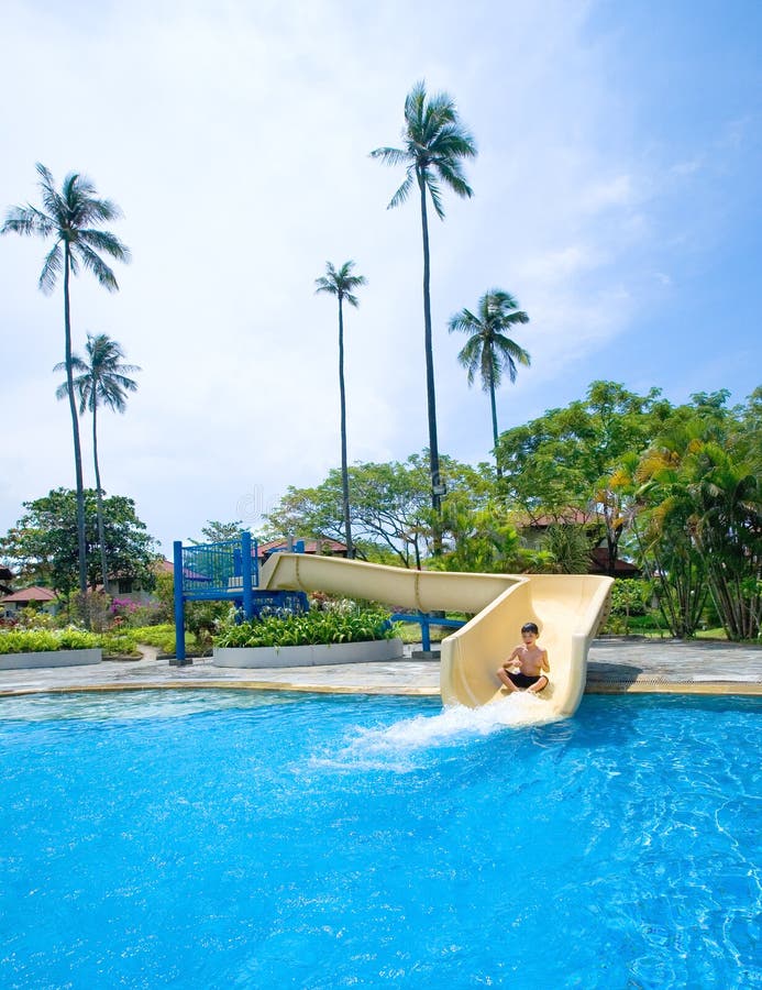 Boy Going Down the Slide at Swimming Pool Stock Image - Image of ...