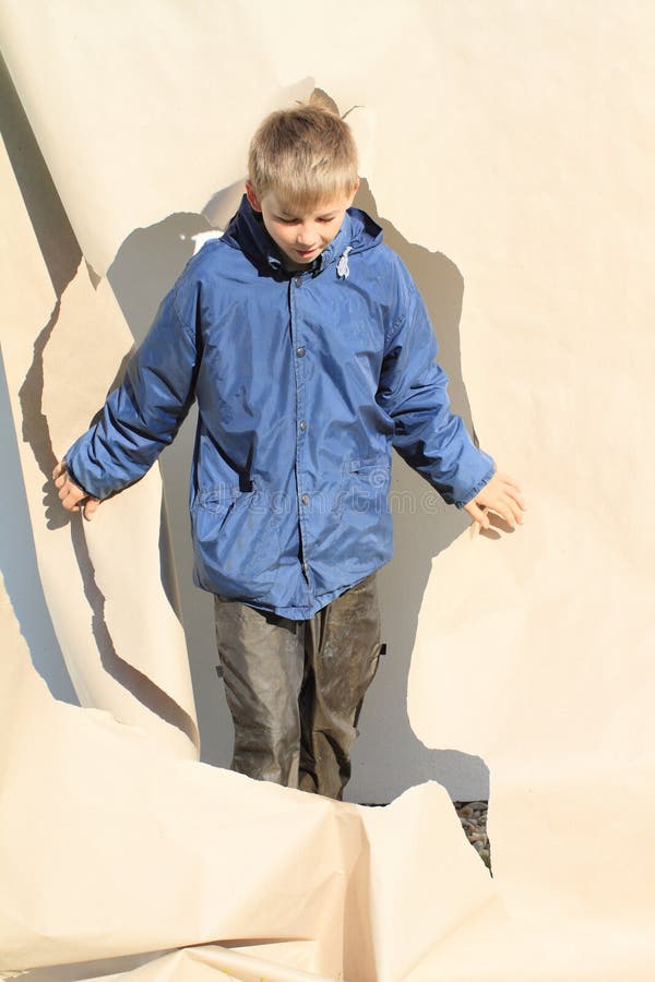 Boy going thru hole stock image. Image of trousers, pluck - 33615587