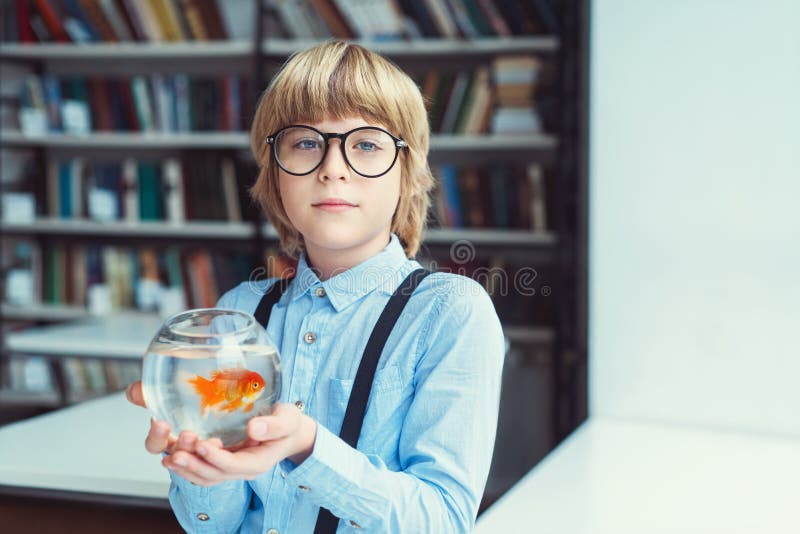Boy with goldfish stock photo. Image of person, aquarium - 91059494