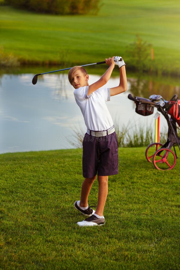 Boy playing golf stock photo. Image of competition, male - 104134200